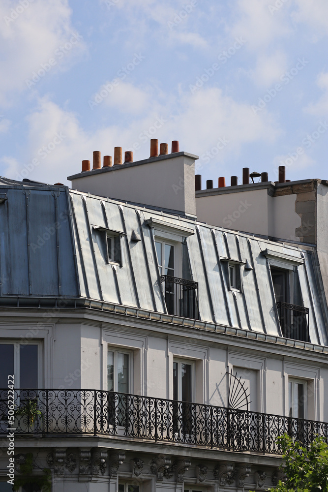 The famous Parisian attics (mansard roofs) on the top floors of 19th ...