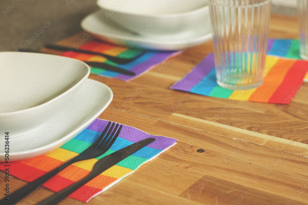Preparing for dinner during pride month using lgbt flag colored napkins ...