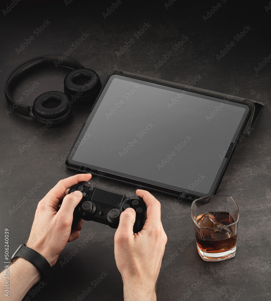 Gaming process with joystick in hand. Mockup template on dark ...