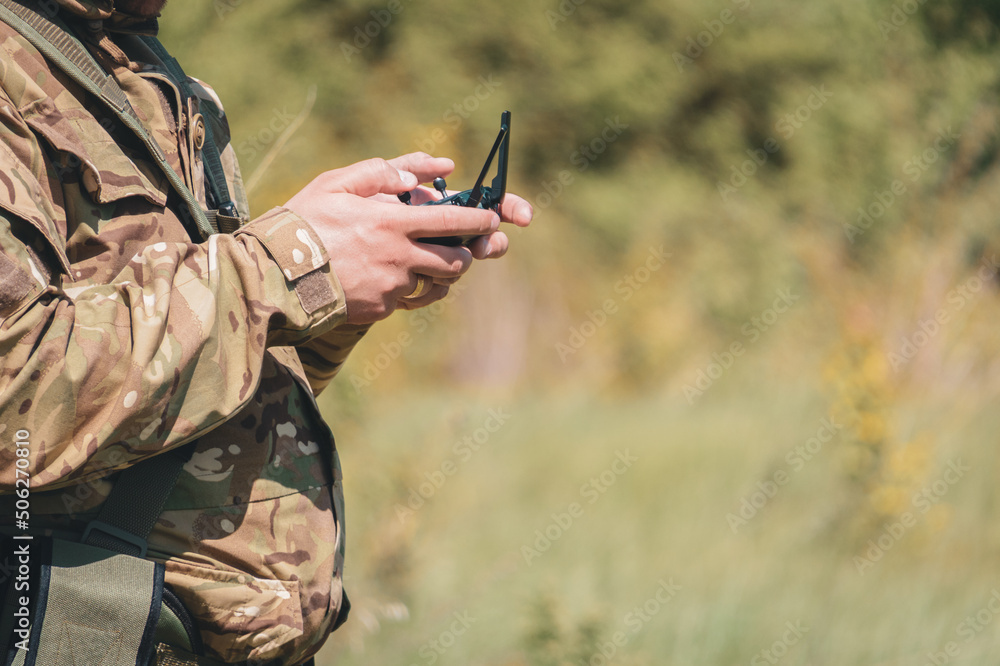 Military man with drone control panel Stock Photo | Adobe Stock