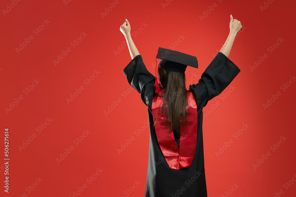 Back view of slim girl standing, graduating from college, university ...