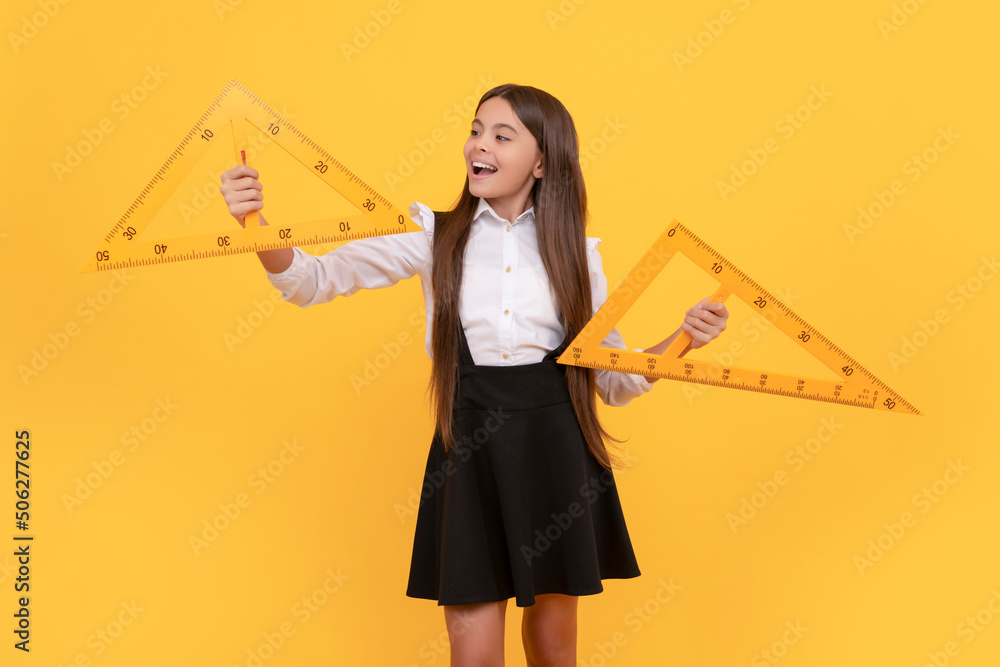 happy child in school uniform hold mathematics triangle for measuring ...