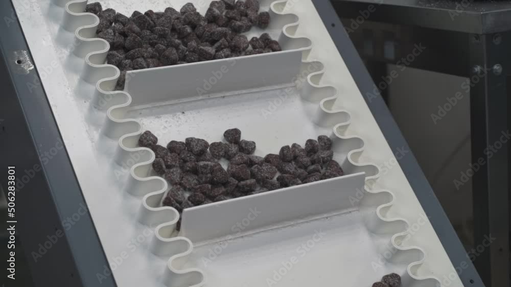 making machine of chocolate sweets. Chocolate factory. Sweets ...