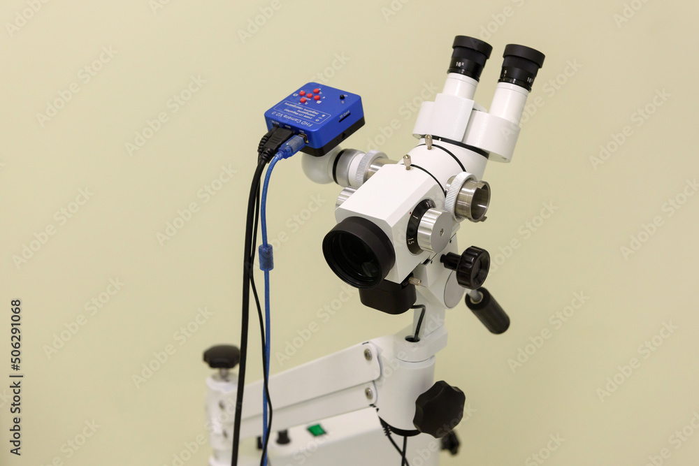 Colposcope in the gynecologist's office. Videocolposcopy of the cervix ...