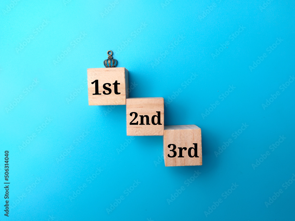 Crown and wooden block with the number 1st,2nd and 3rd on blue ...