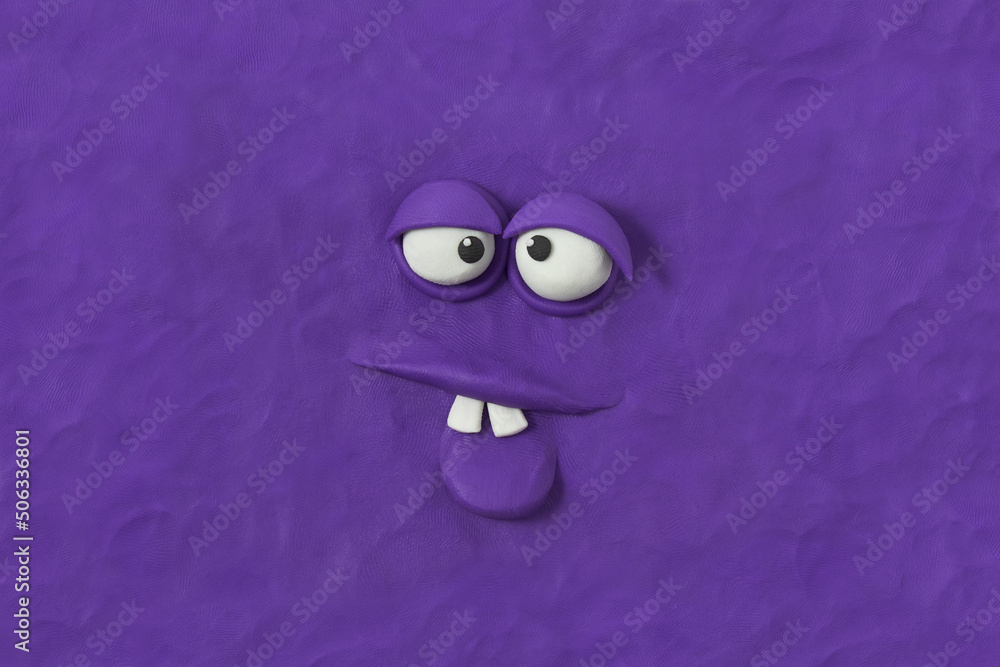 Cute monster, fabulous creature made by hand from purple plasticine ...