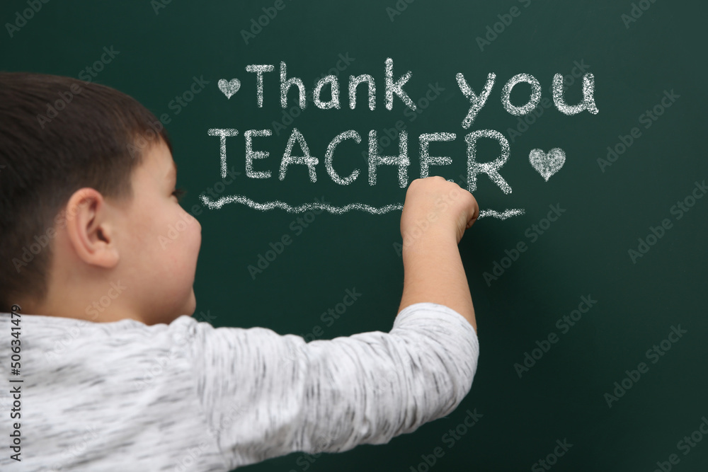 Cute little boy written phrase Thank You Teacher on green chalkboard ...
