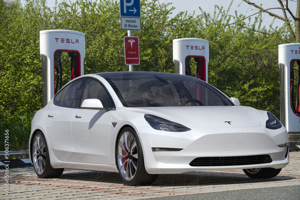 Tesla Model 3 at the charging station Stock Photo | Adobe Stock