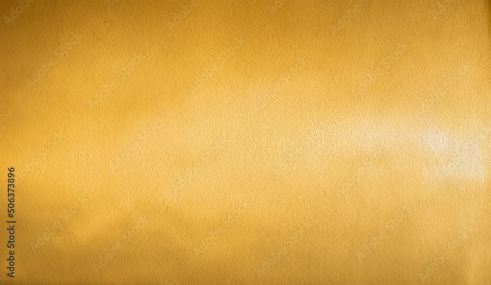 Gold wall texture background. Yellow shiny gold paint on wall surface ...