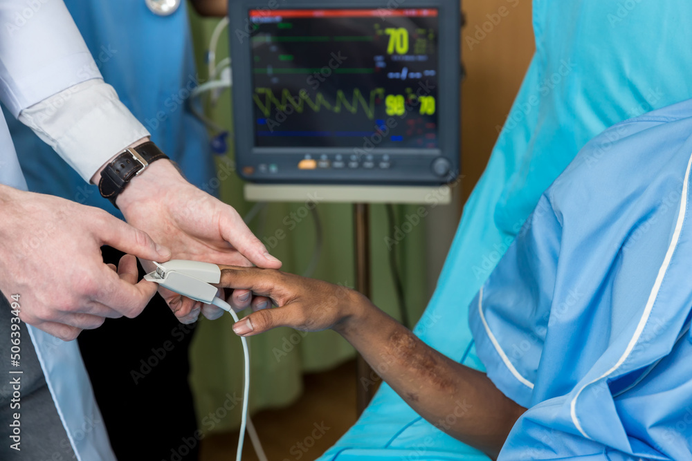 Patient checking oxygenation with fingertip pulse oximeter. Saturation ...