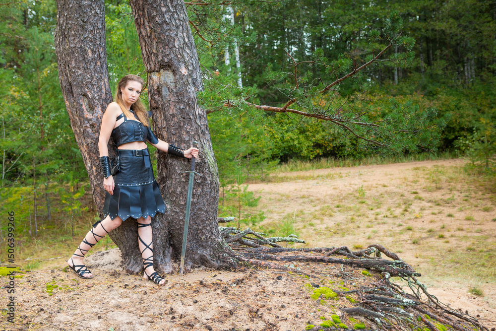 Fotografia do Stock: Pretty barbarian lass wearing black leather ...