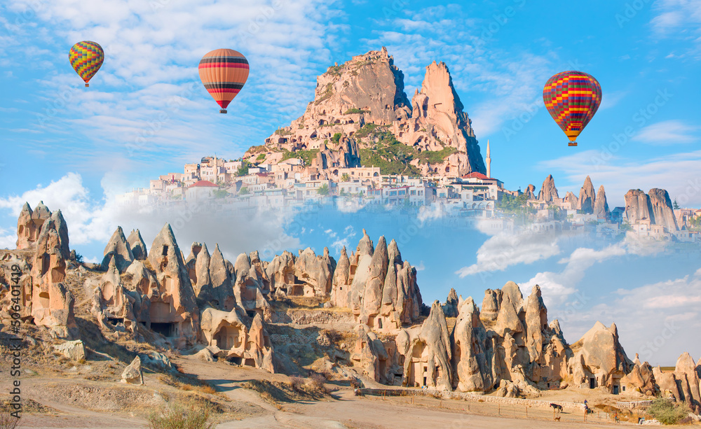 Hot air balloon flying over spectacular Cappadocia, Uchisar castle in ...