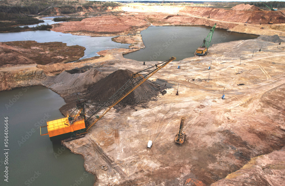 Walking dragline excavator in open pit on dolomite development. Big ...