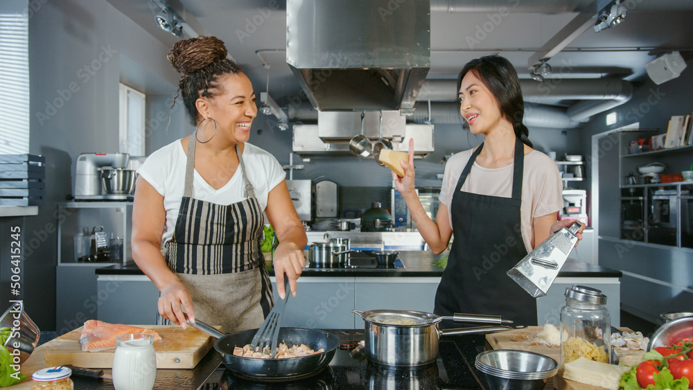 TV Cooking Show Kitchen with Two Master Chefs. Two Female Presenters ...