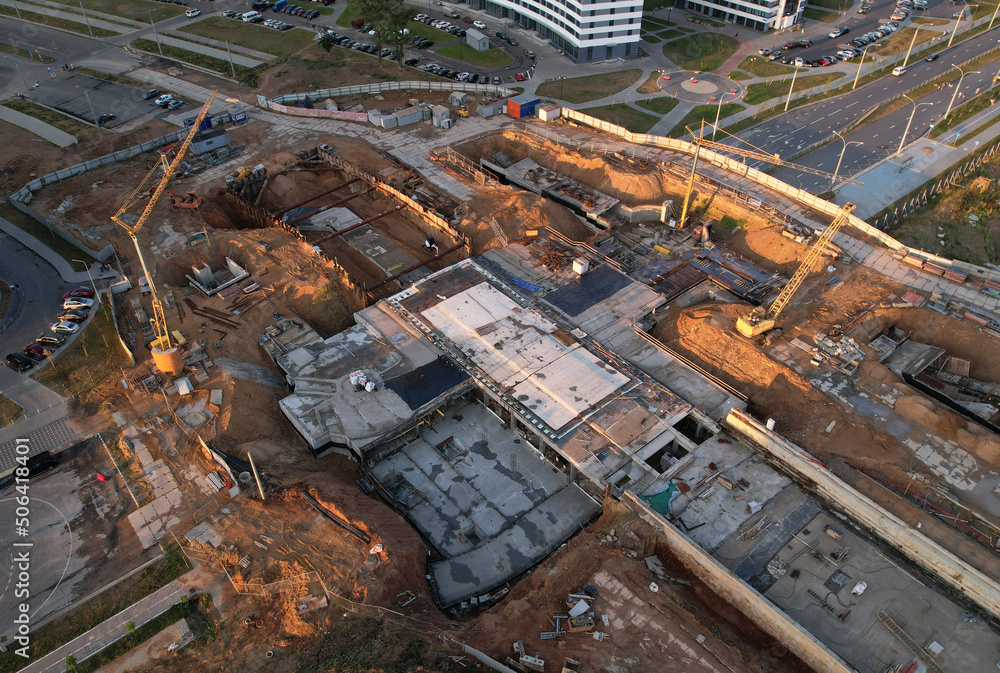 Construction site with tower cranes on construction. Foundation slab ...
