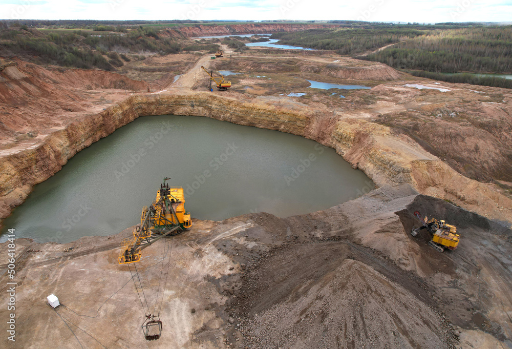 Walking dragline excavator in open pit on dolomite development. Big ...