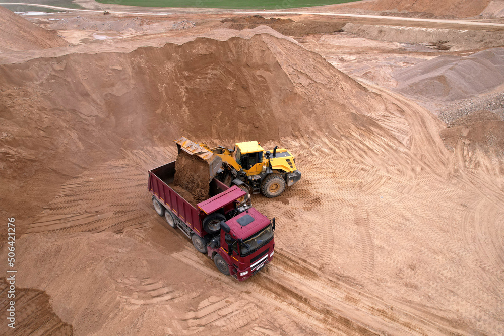Wheel Loader Load Sand In Dump Truck In Open Pit Front End Loader On Earthworks In Open Pit