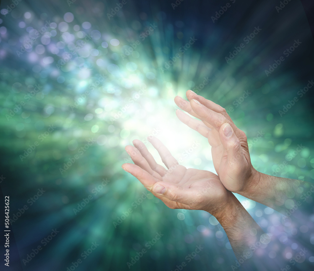 Channelling healing energy to where it is needed - male cupped hands ...