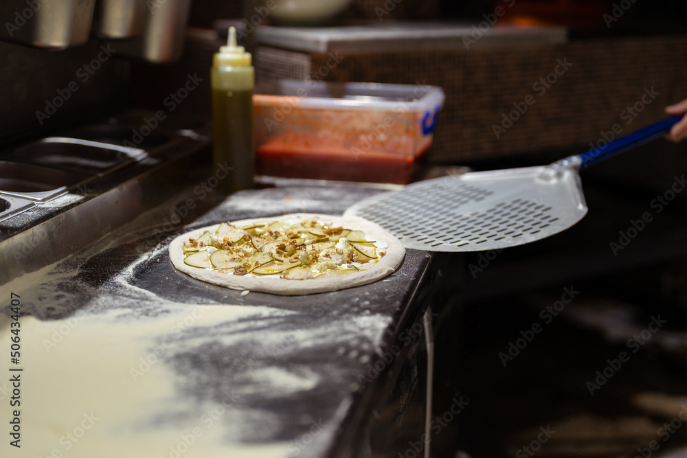Pizza making process. Male chef hands making authentic pizza in the ...