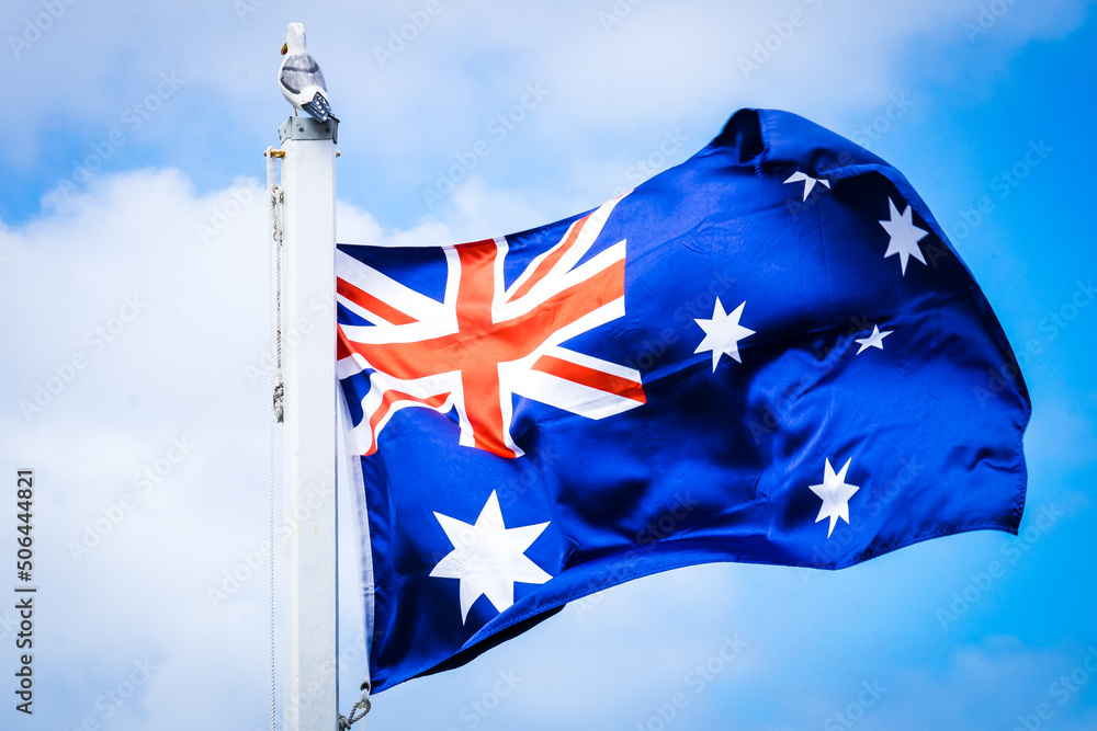 Australian flag flying on flagpole with wooden seagull Stock Photo ...