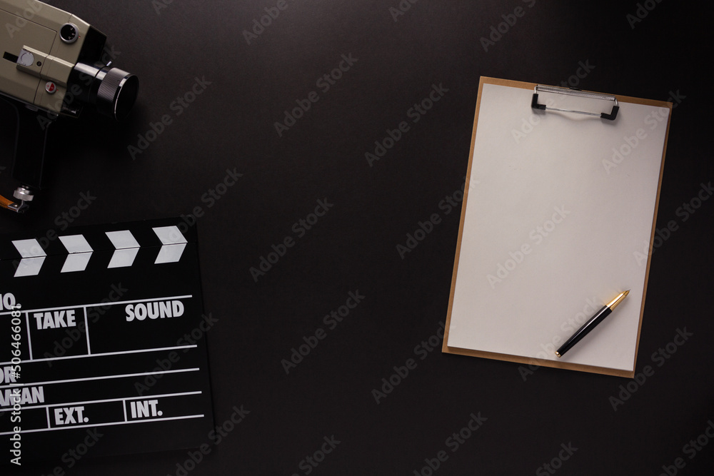 Clapboard and paper at black background texture. Movie idea concept ...