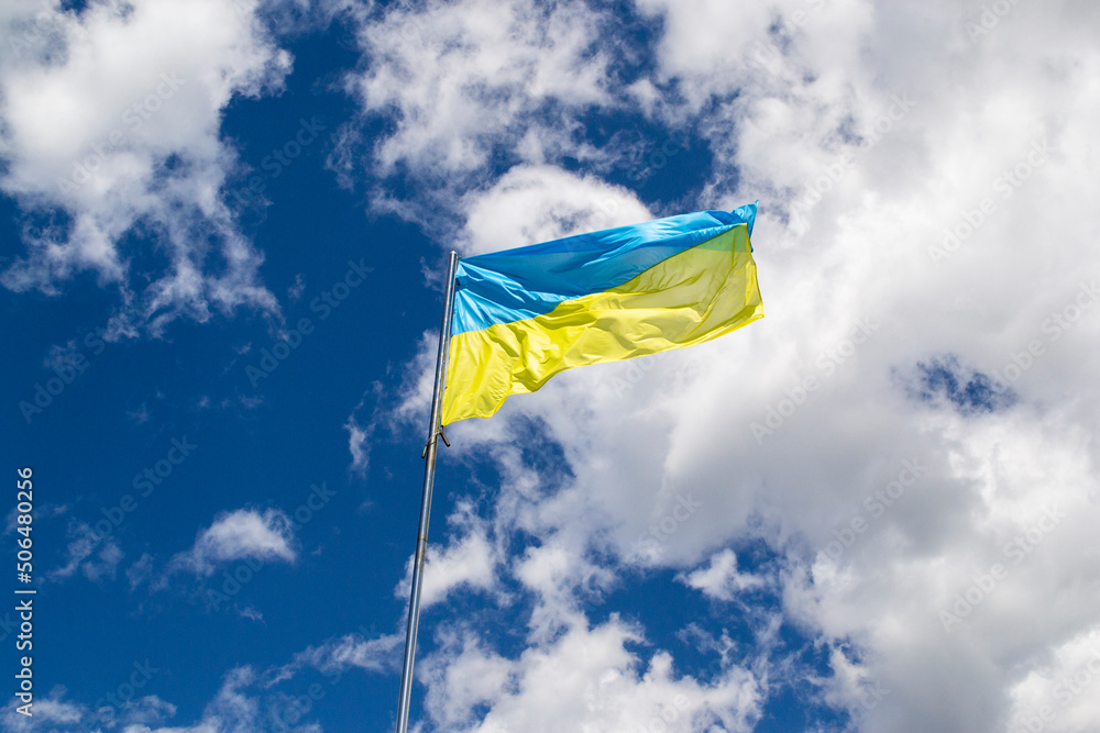 Ukrainian Flag, blue and yellow colors, sky with clouds. National ...