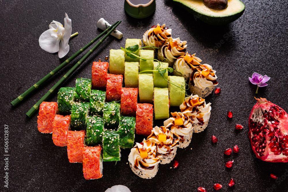 Rainbow Sushi set with salmon, eel, tuna, avocado, royal prawn, cream ...