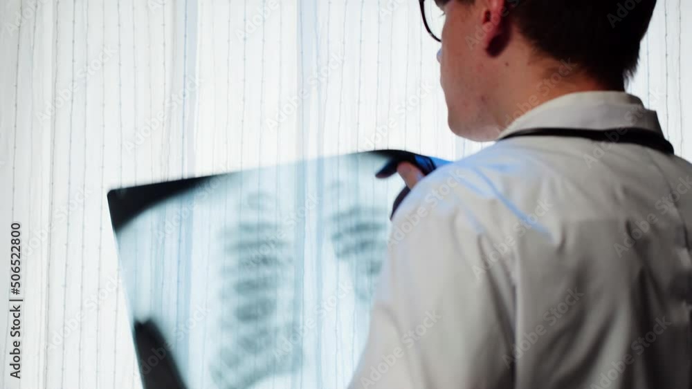 Healthcare and medicine. Doctor examining lungs x-ray close-up. Male ...