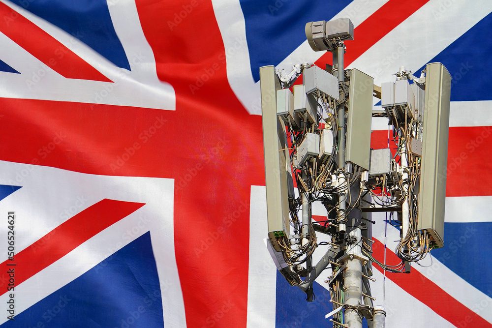 5G network antenna base station on background UK flag. 6G network ...