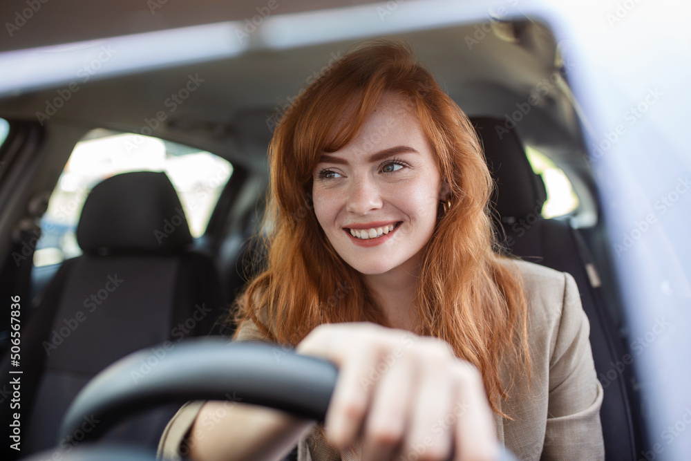 Beautiful young woman driving her new car at sunset. Woman in car ...