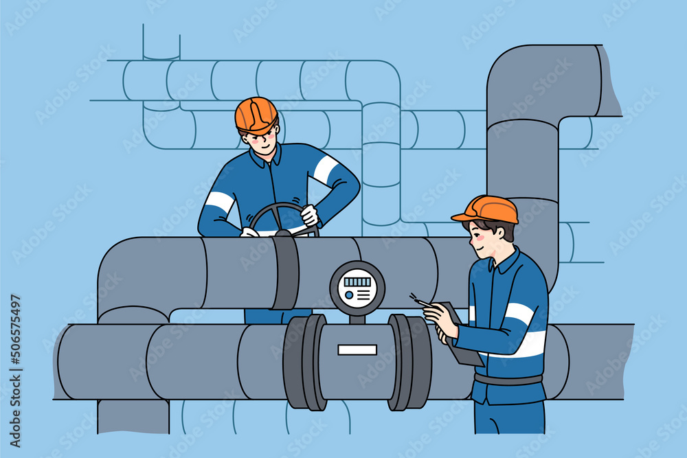 Male workers in uniform inspect and maintain water tubes and pipes ...