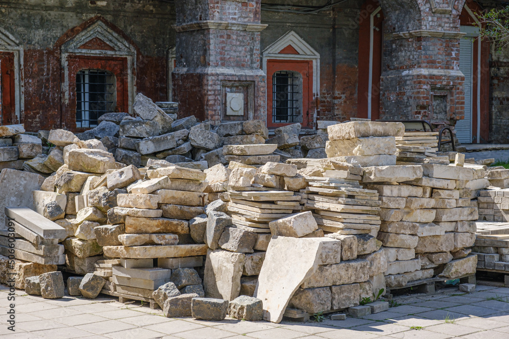 Heaped old marble slabs. Carrying out works on the restoration of ...