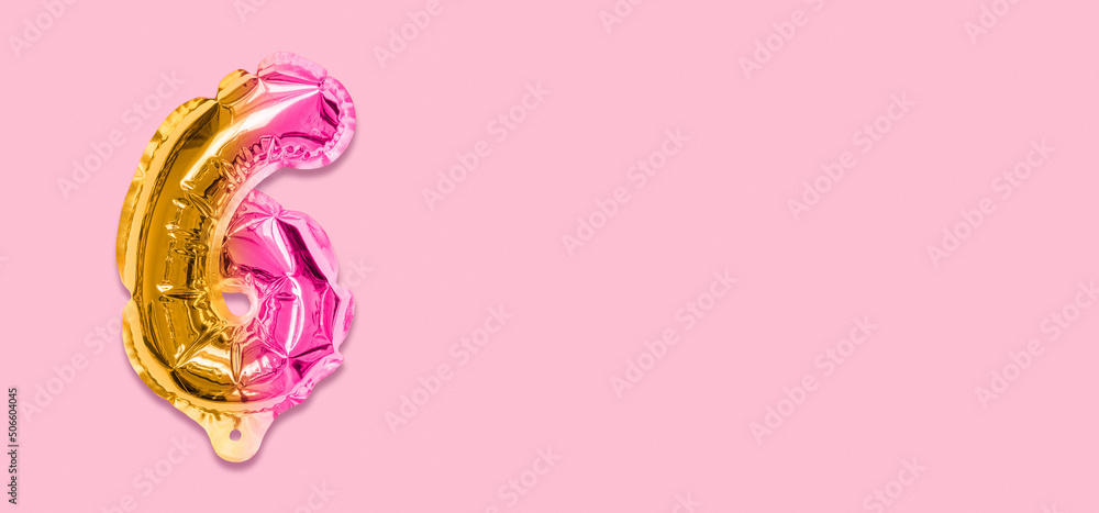 Rainbow foil balloon number, digit six on a pink background. Birthday ...