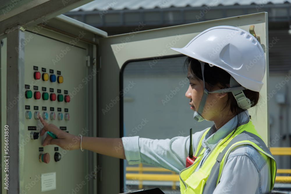 electrician working in panel. Women engineer check panel broad of ...