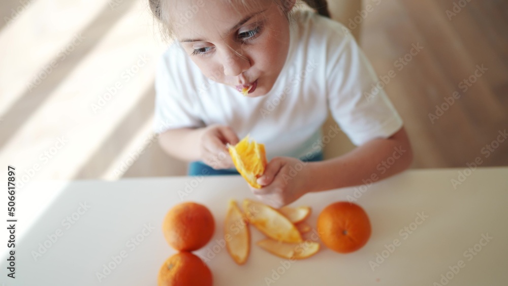girl child eating oranges. dream happy family fruit healthy food kid ...