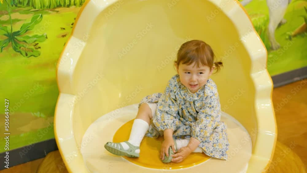 Cute And Pretty Little Girl Sitting On Cracked Egg Shell-like Chair At ...
