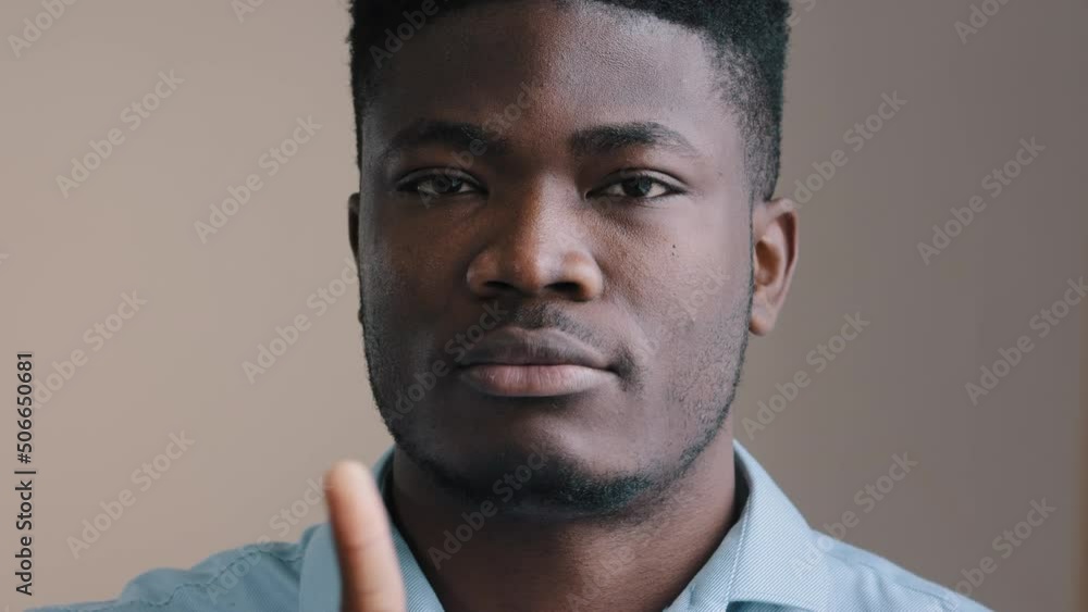 Serious Young Angry African American Adult Guy Sternly Look At Camera