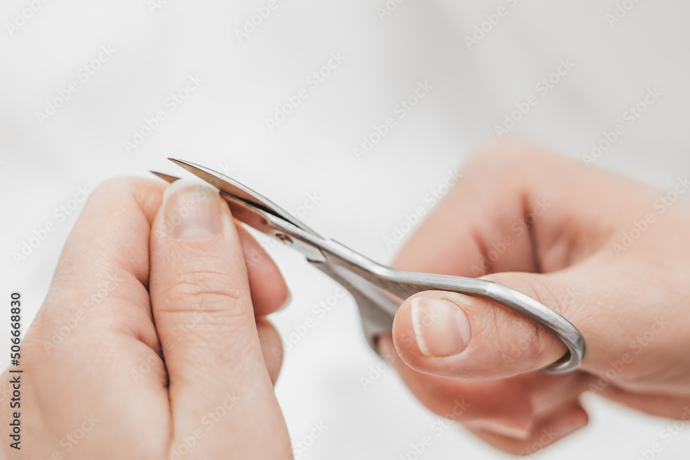 clean nails.kid child girl cutting nails using stainless steel nail ...