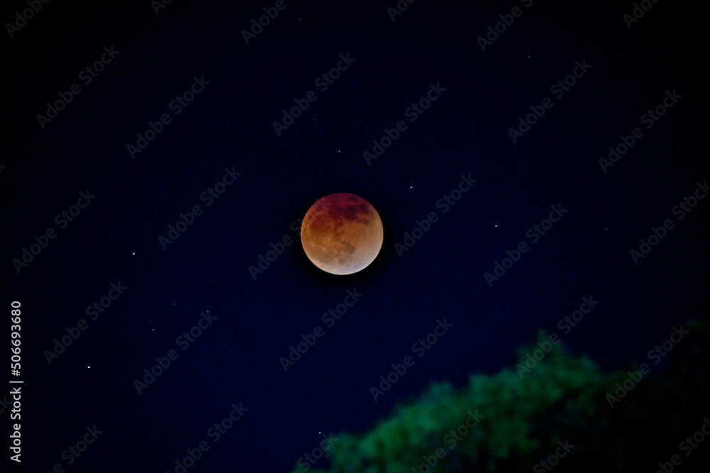 Faint Stars and black sky provide backdrop for Blood Moon. During a ...