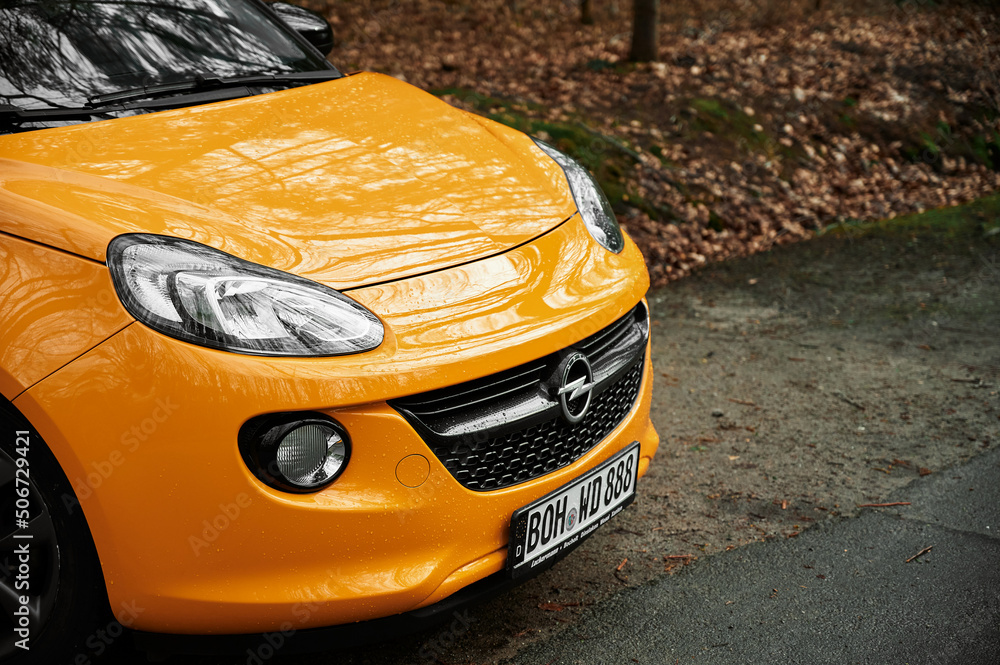 Germany, Bocholt, April 28, 2022: The front end is a bright yellow Opel ...