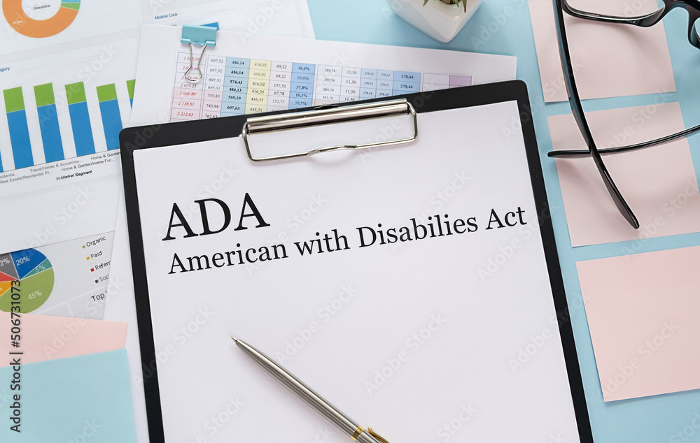 Foto de Paper with Americans with Disabilities Act ADA on a table do ...