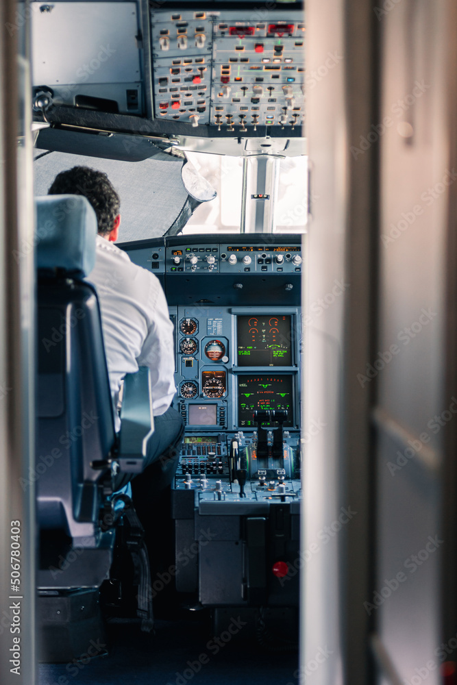 controls and buttons of an aircraft. Pilot in the cockpit making flight ...