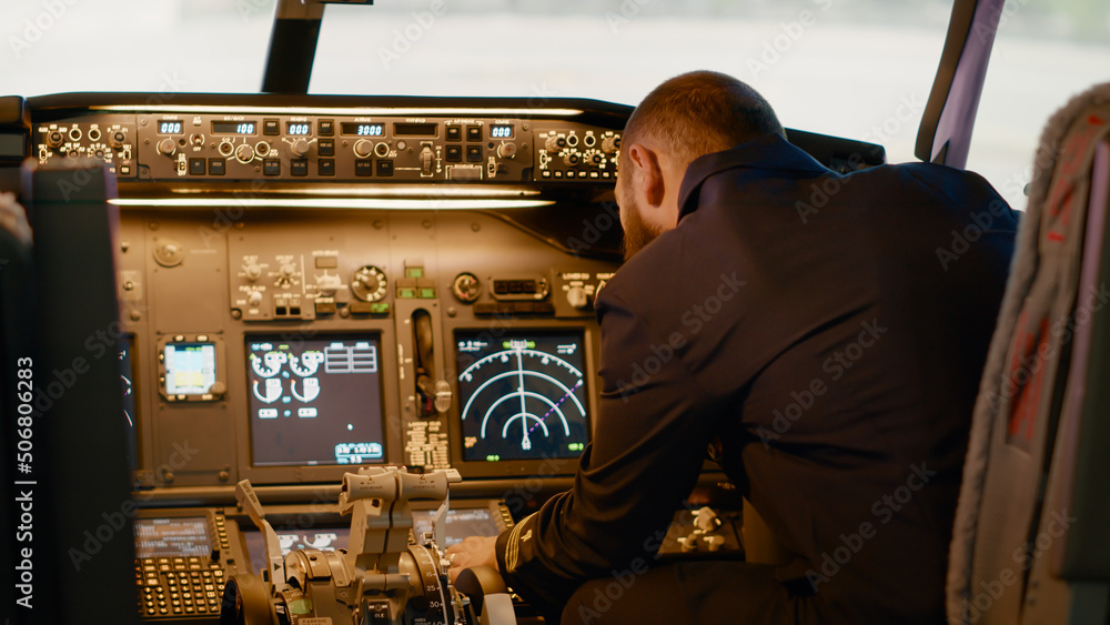 Aviation captain putting coordinates to fly airplane to destination ...