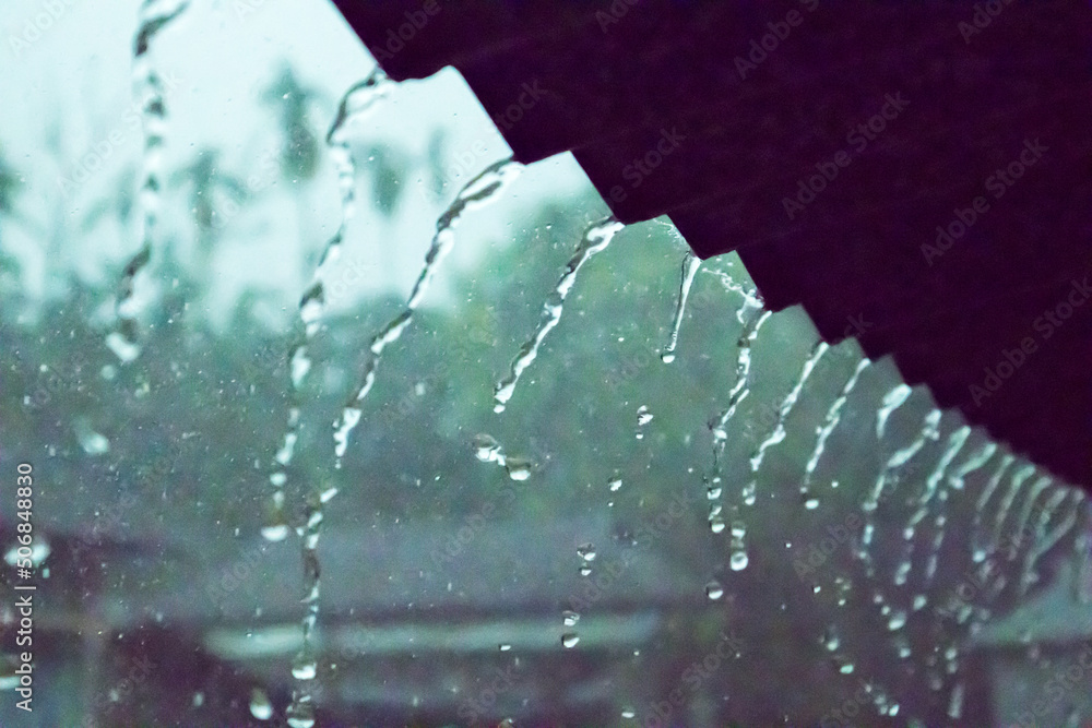 Rain water falling by the GI sheet Stock Photo | Adobe Stock