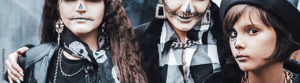 Scary family, mother, daughters celebrating halloween. Terrifying black ...