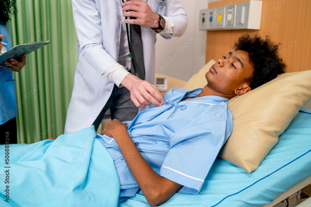 African patient is analyzed disease by the doctor using stethoscope to ...