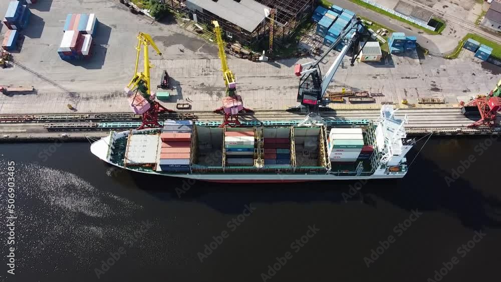 Container ship on loading in the seaport, aerial view from a drone of ...