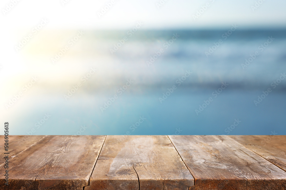 Wooden table and blurred sea background. Summertime and vacation Stock ...