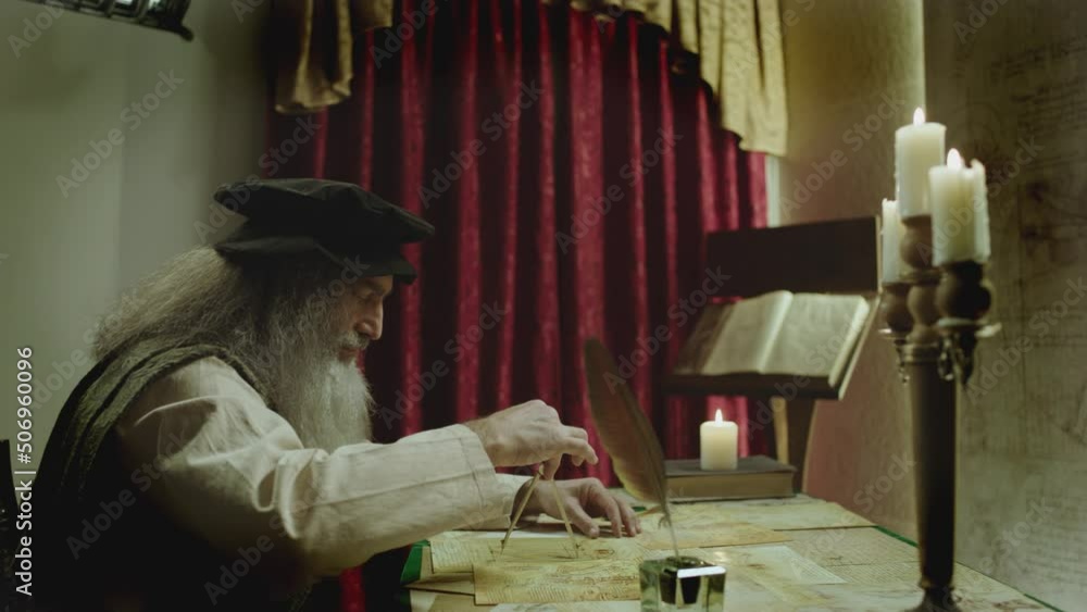 Old man or duplicate of LEONARDO DA VINCI writing , painting , working ...
