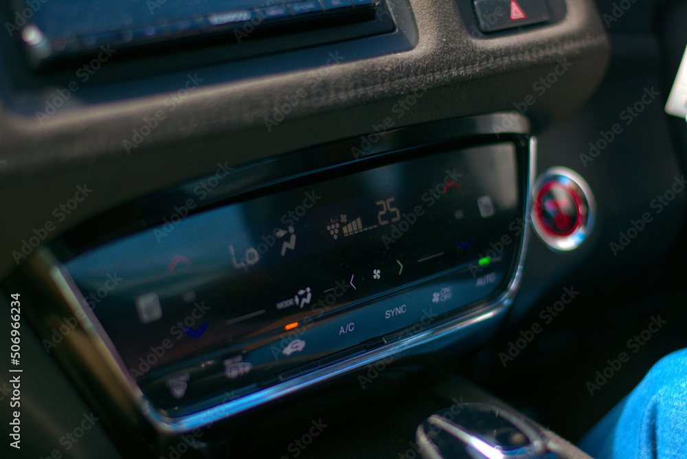 close up of a car dashboard, hybrid electric car dashboard climate ...